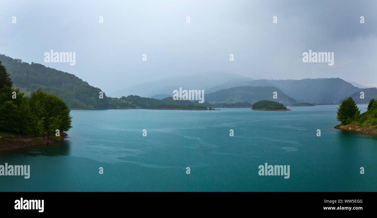 Panoramic picture of a reservoir with overcast rain clouds Stock Photo ...