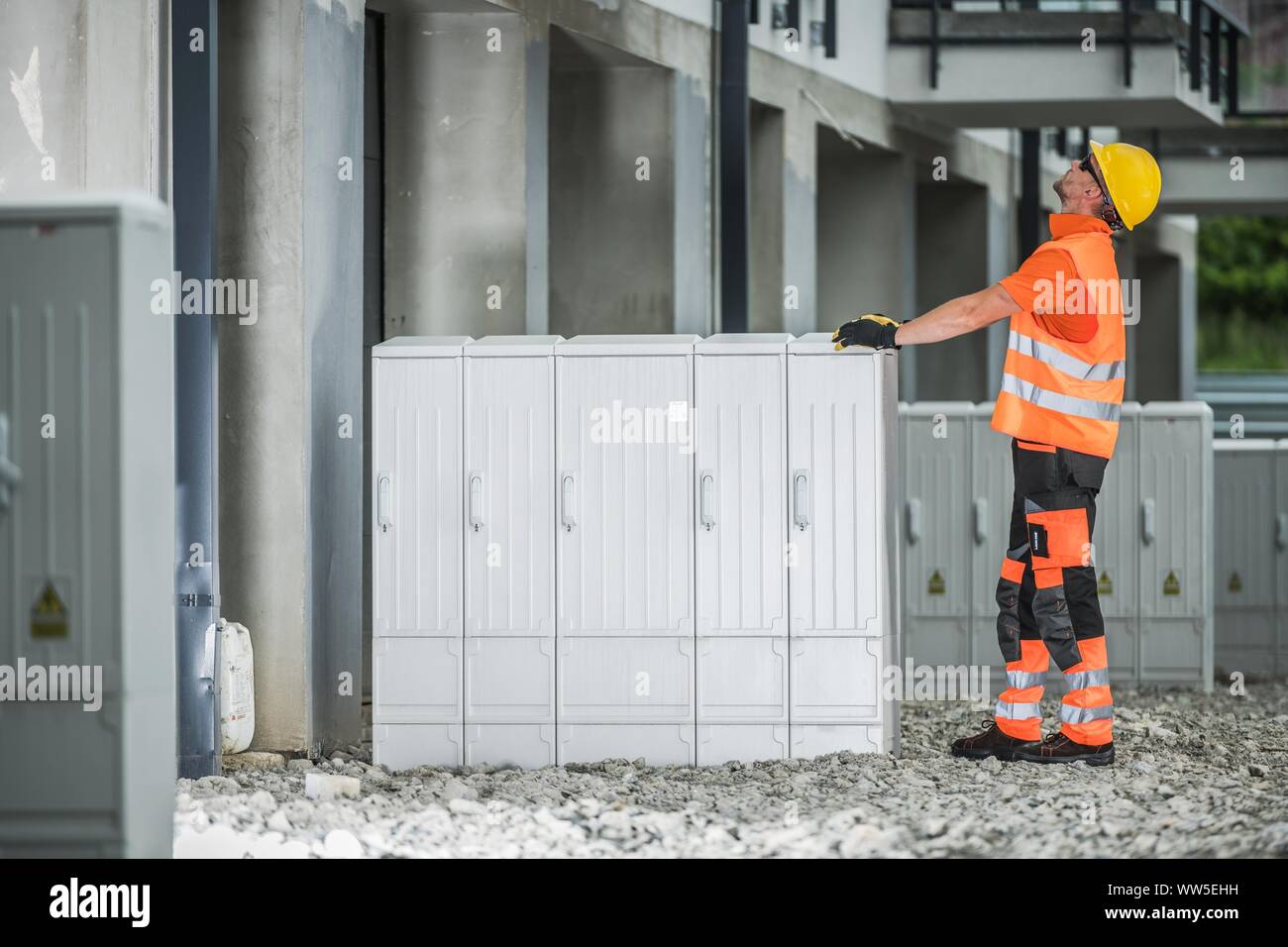 Electric Boxes Installation. Caucasian Construction Worker in Front of ...