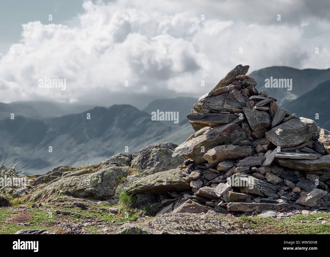 Pile of stones, summit cairn on Whiteless Pike on a sunny day in the ...