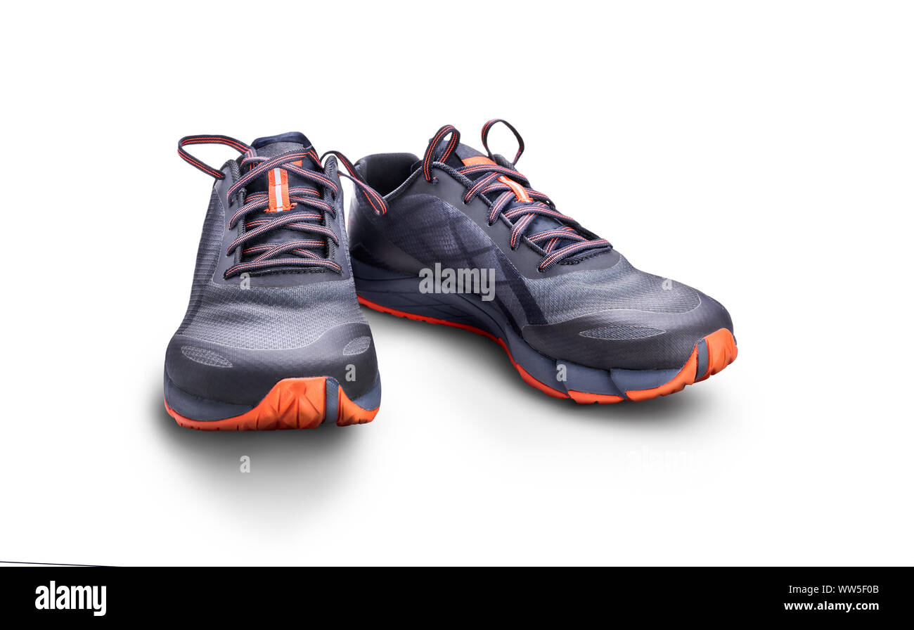 Front view of gray and orange trainers isolated on a white background ...