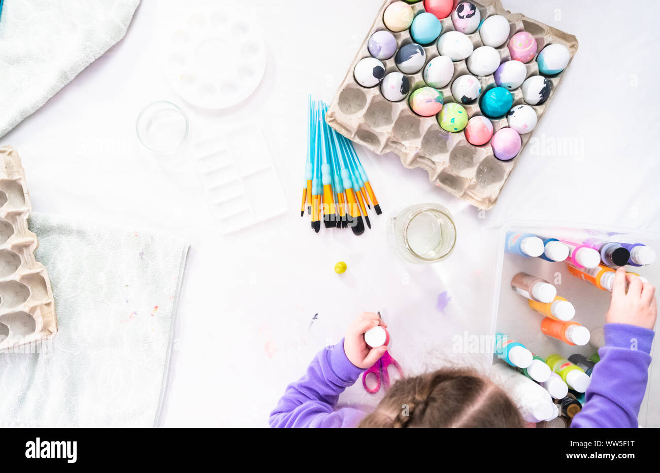 Flat lay. Painting craft Easter eggs with arcylic paint Stock Photo - Alamy