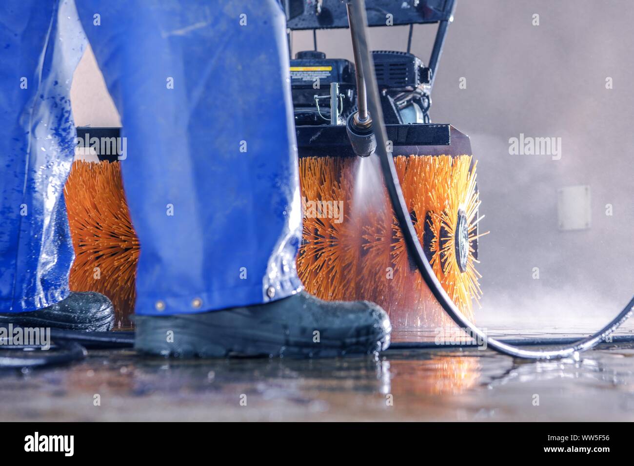 Pressure Washing Work. Men Cleaning His Brush Cleaner Using Powerful ...