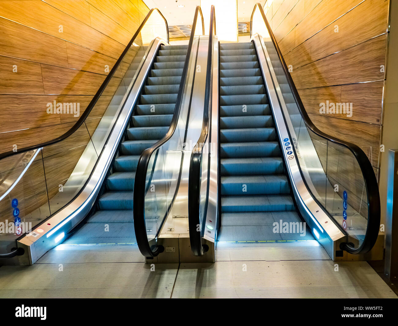 Escalator at an airport with no people. Symmetrical architecture ...