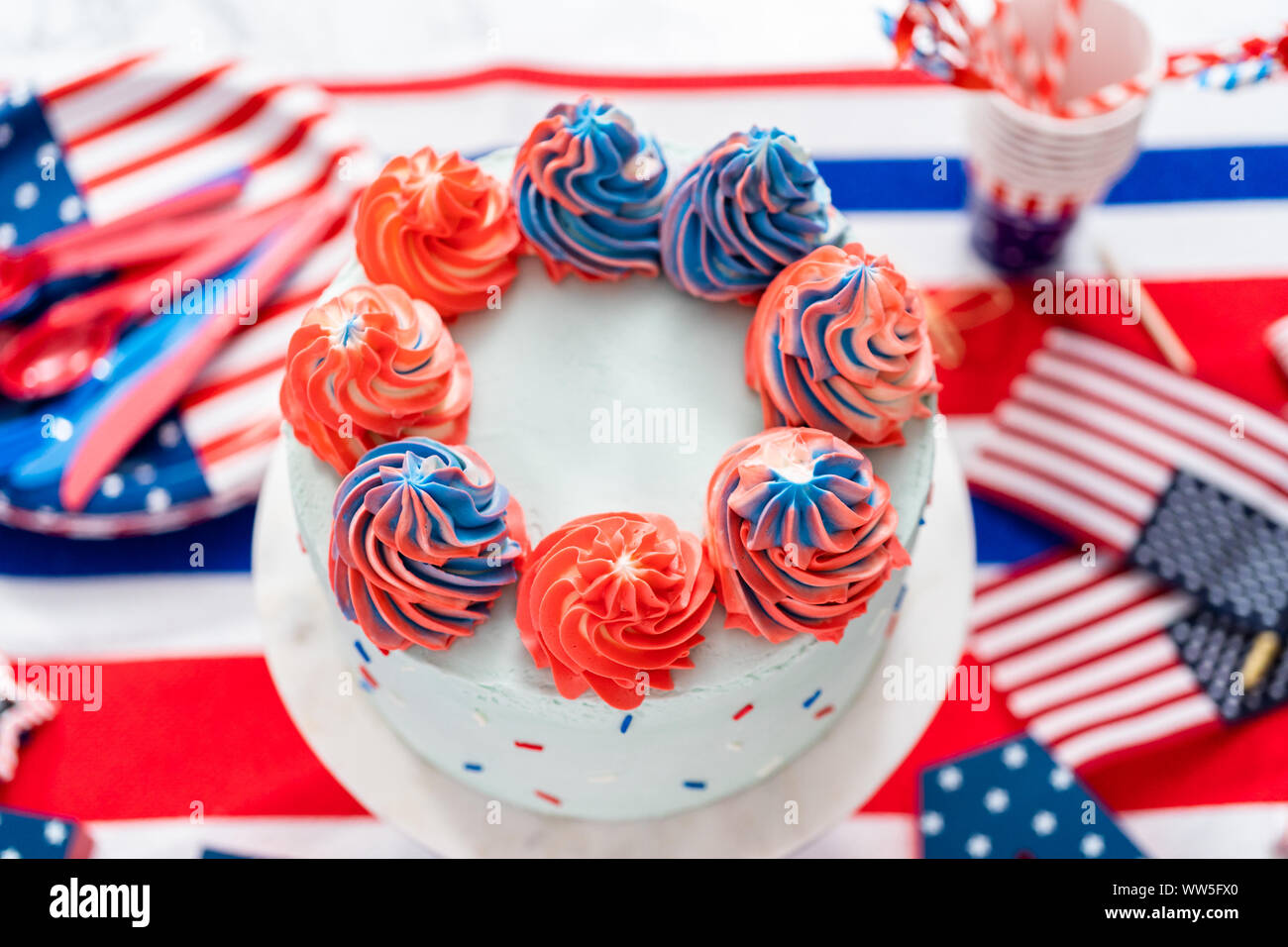 Red, white, and blue round vanilla cake with buttercream frosting for ...
