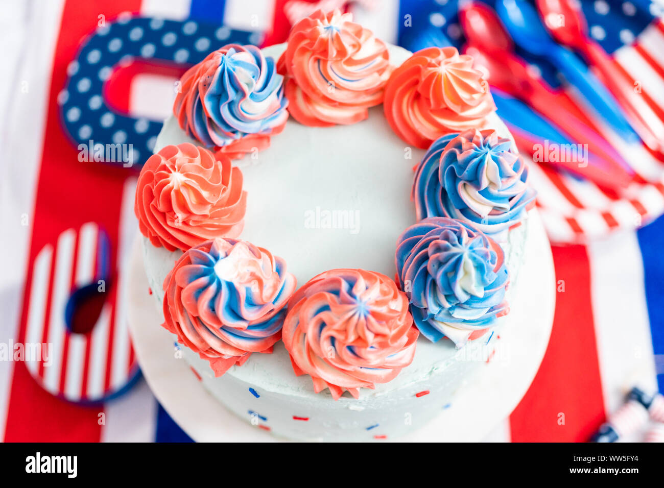 Red, white, and blue round vanilla cake with buttercream frosting for ...