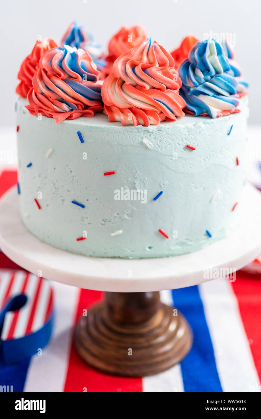 Red, white, and blue round vanilla cake with buttercream frosting for ...