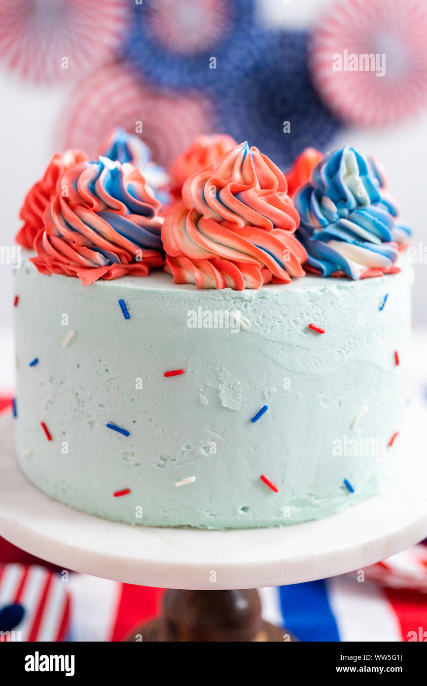 Red, white, and blue round vanilla cake with buttercream frosting for ...