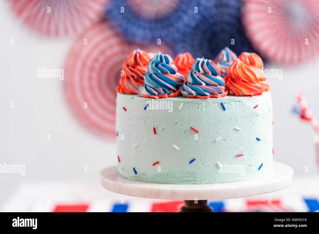 Red, white, and blue round vanilla cake with buttercream frosting for ...