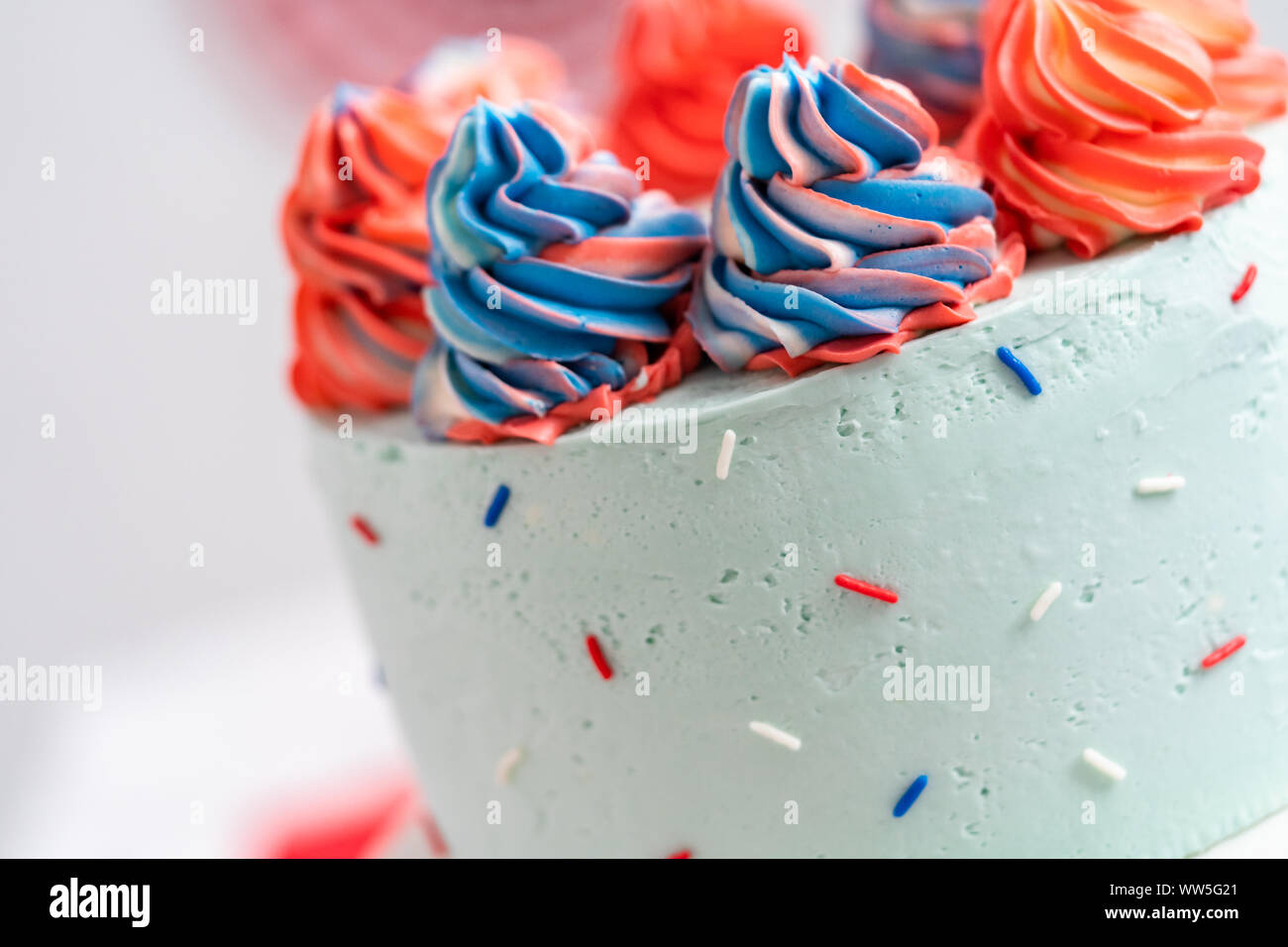 Red, white, and blue round vanilla cake with buttercream frosting for ...