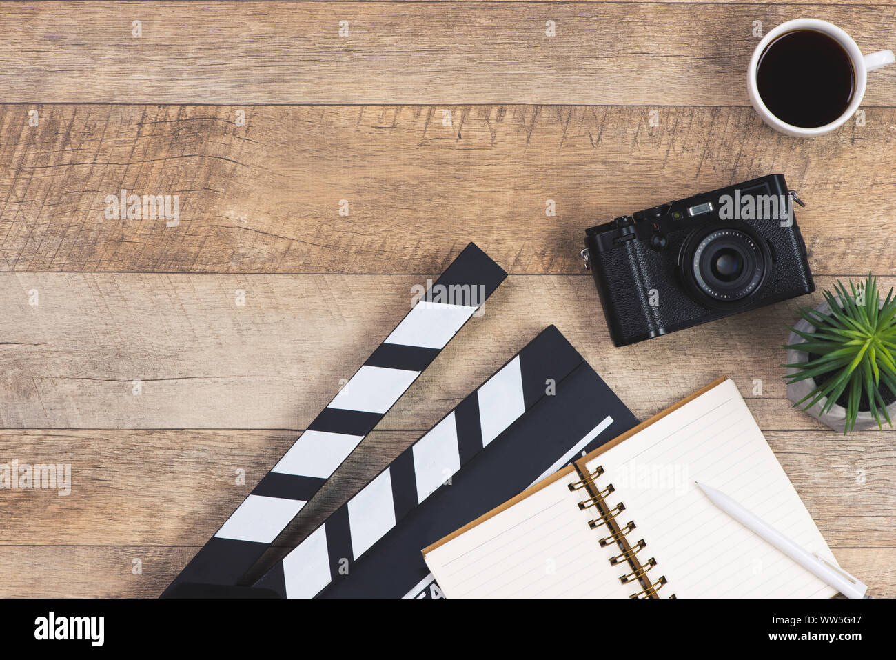 Film director desk with movie clapper board. Top view Stock Photo - Alamy