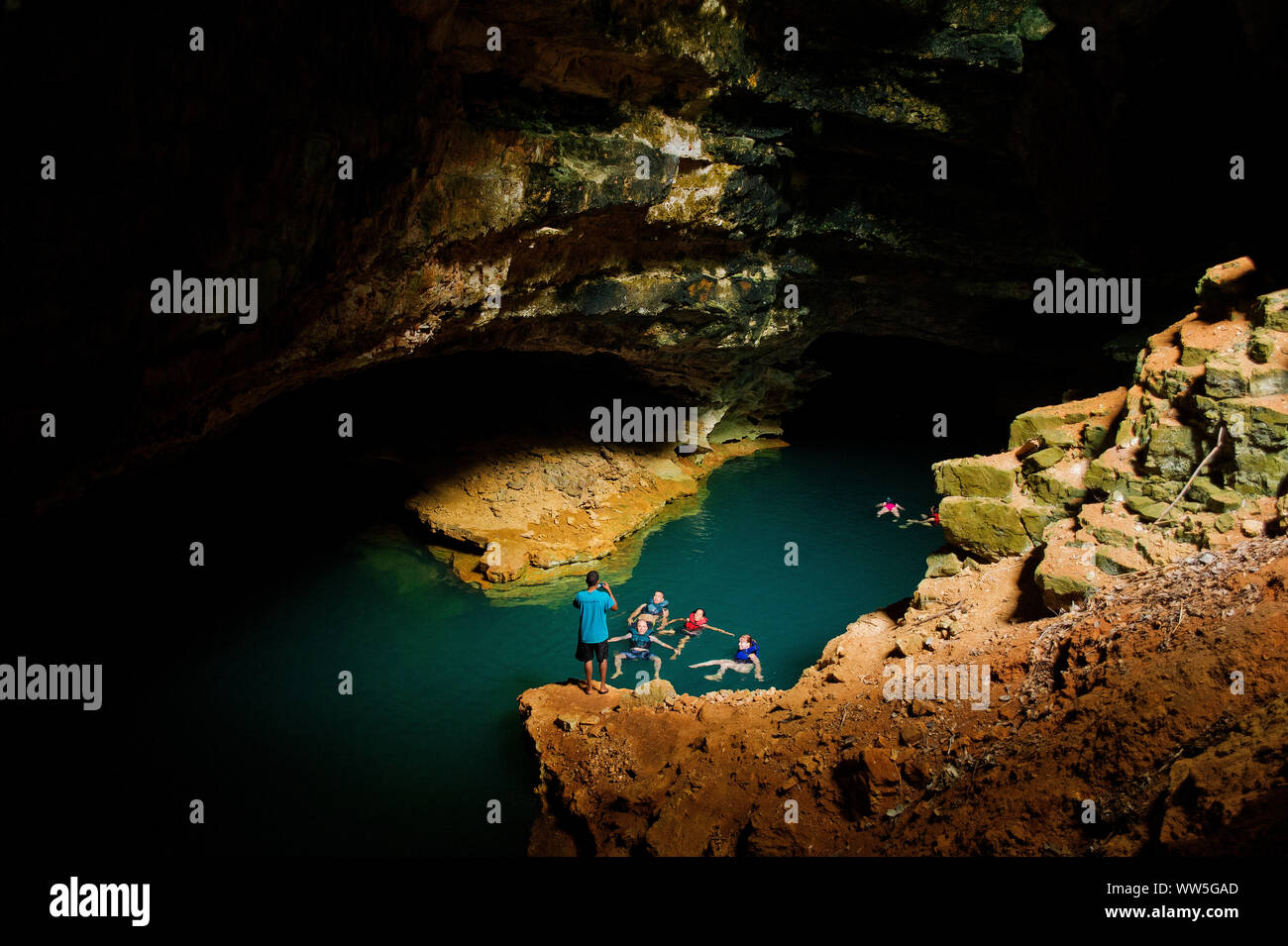 Tourists swimming at the Poço Azul at Chapada Diamantina, Bahia, Brazil ...