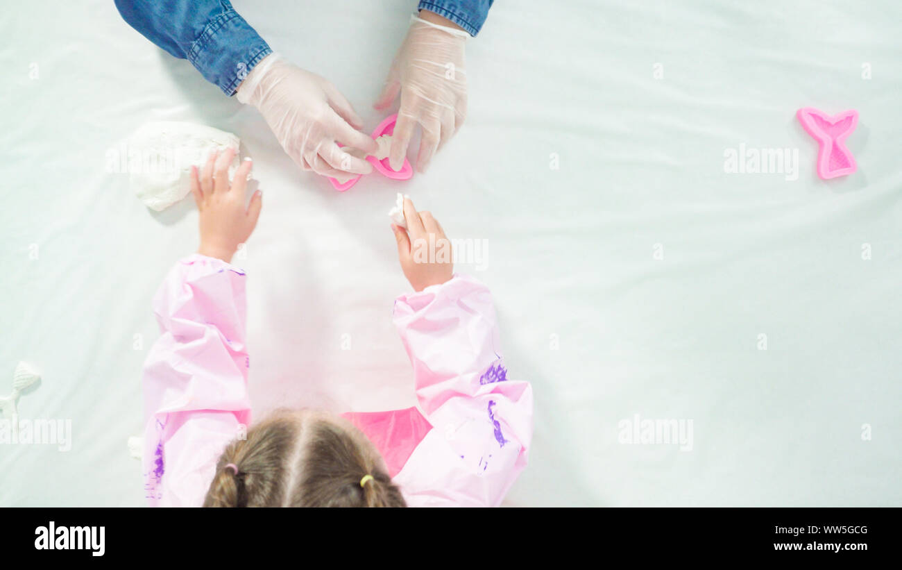 Flat lay. Step by step. Making mermaid tail from modeling clay in ...