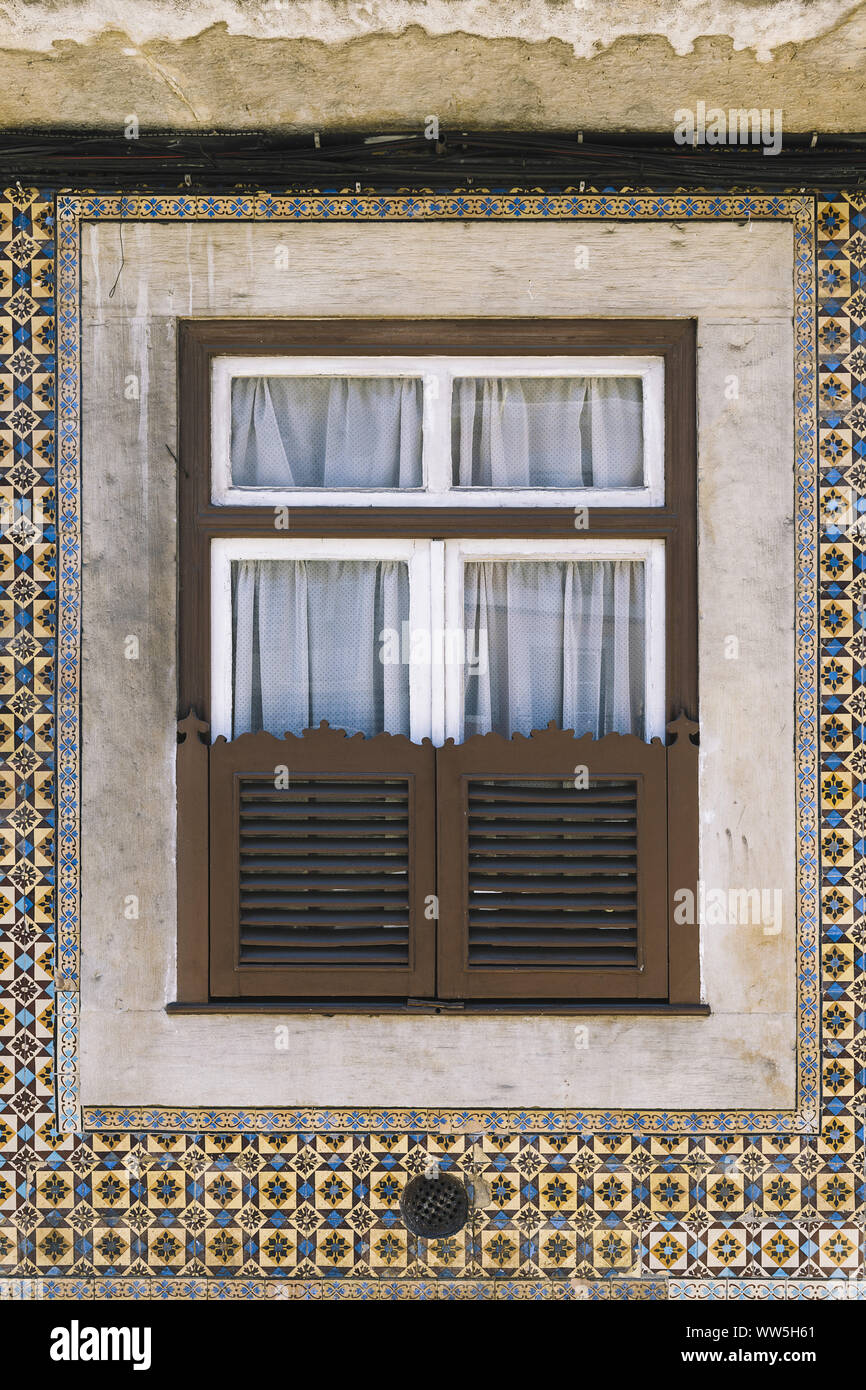 vertical photo of a typical historic old house wooden window in an old ...