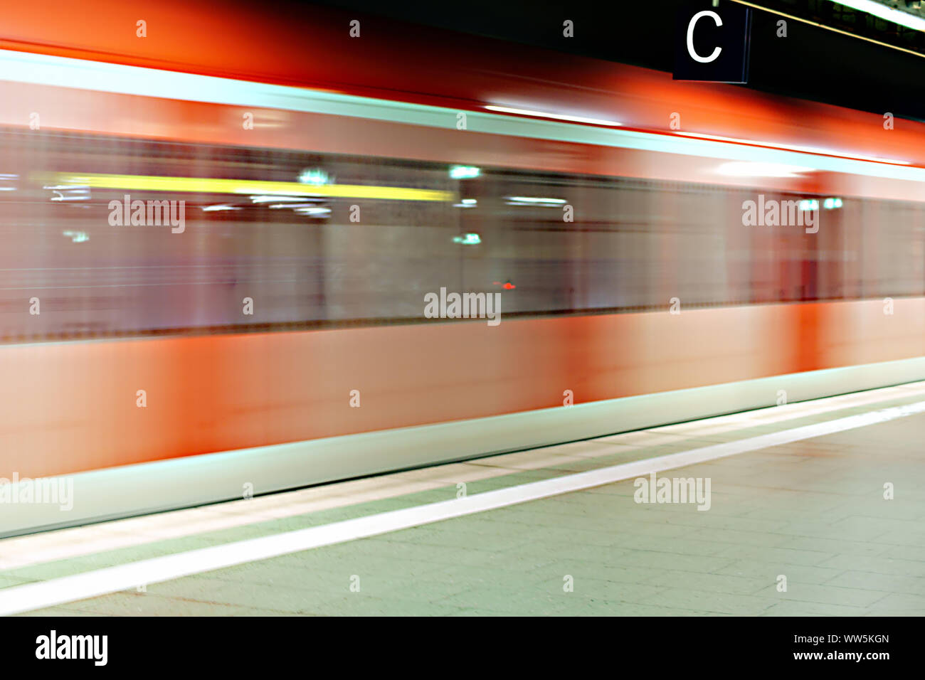 Motion stripes of driving regional train in an underground station hi ...