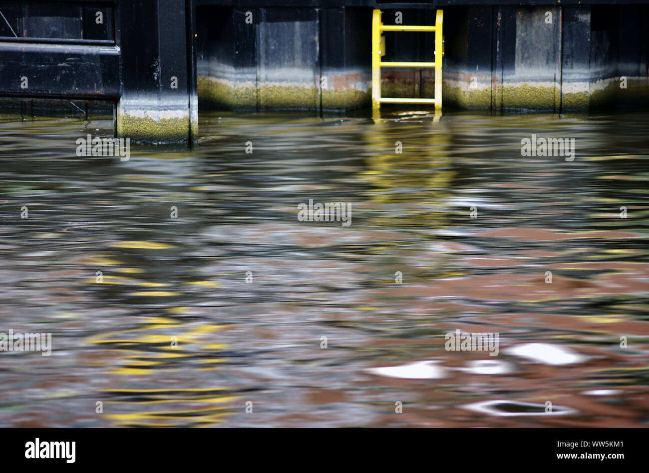 abstract photography and reflection of a quay wall of steel in the ...