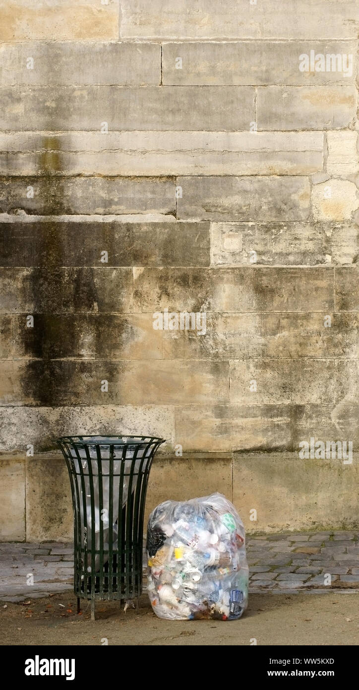 Photography of a dustbin with garbage bag in Paris Stock Photo - Alamy