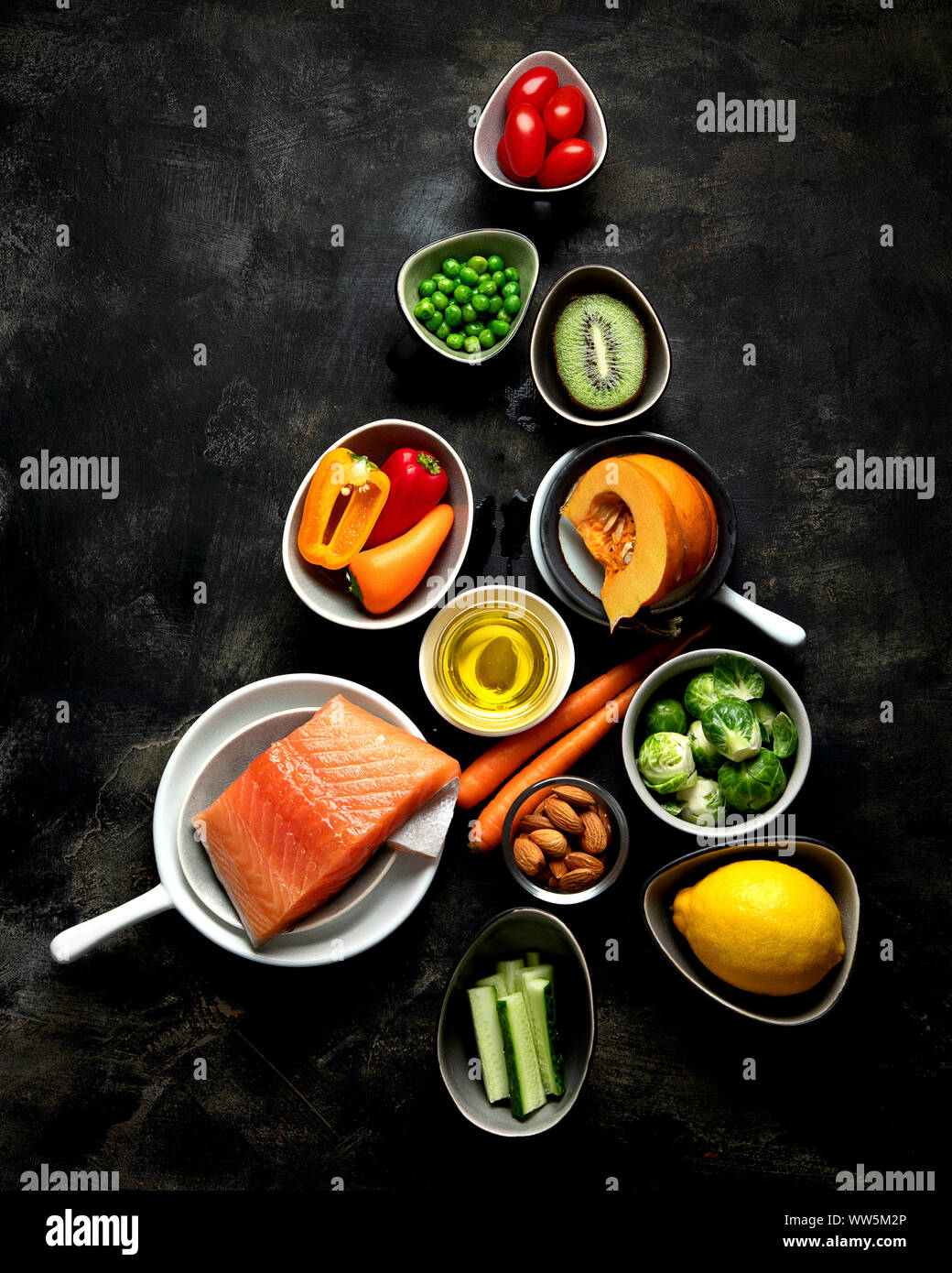Christmas tree made of healthy food on black background. Top view Stock ...
