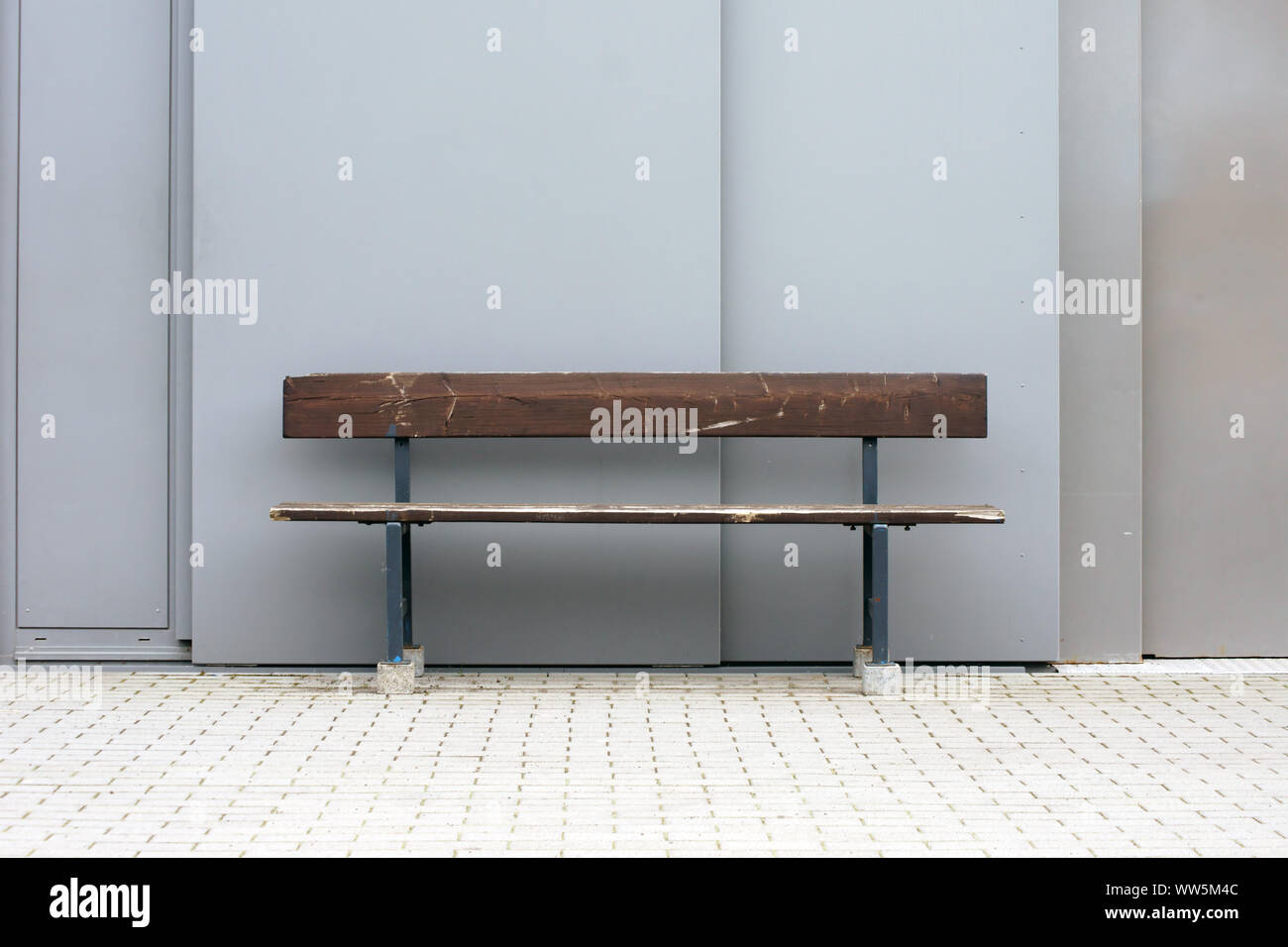 Photography of a park bench at a metal facade hi-res stock photography ...