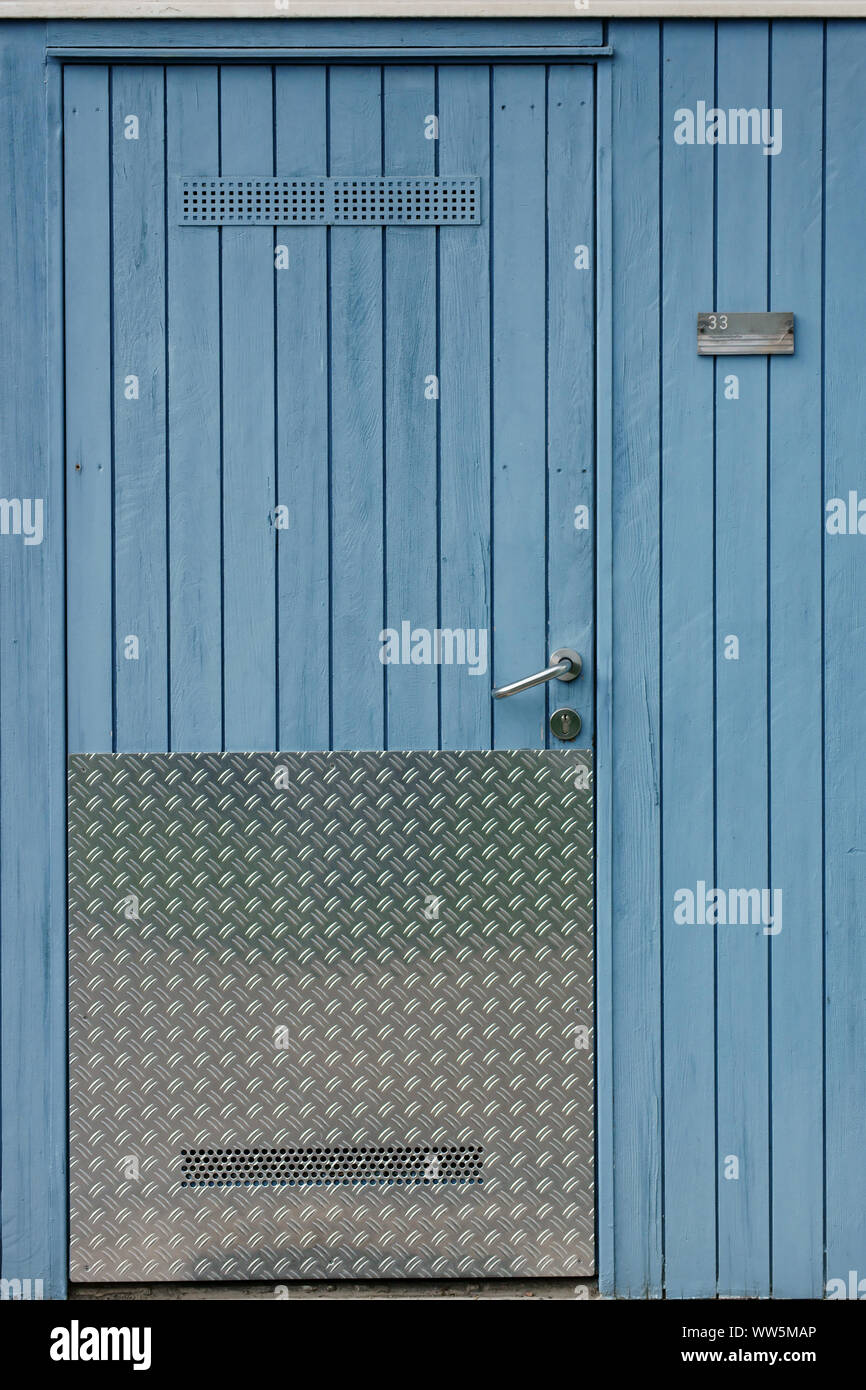 A wooden wall of a house with a matching door Stock Photo - Alamy