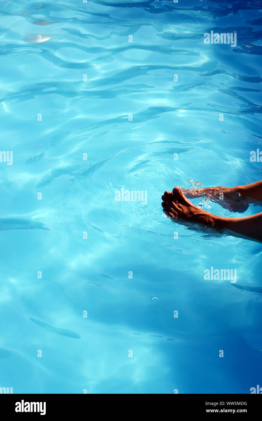 Photography of splashing feet in a swimming pool Stock Photo - Alamy