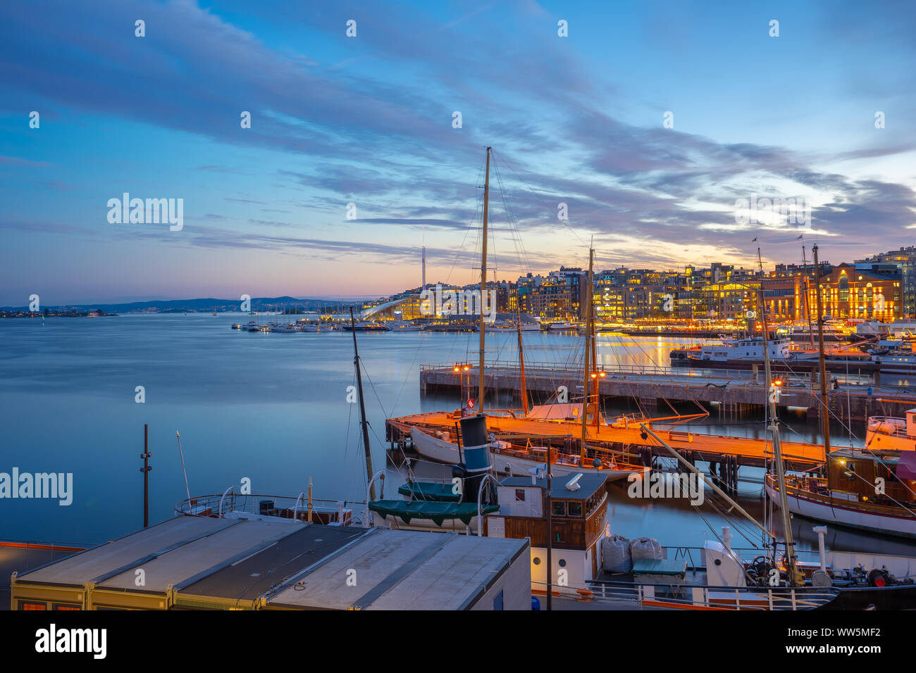 Oslo port with boat and skyline at night in Oslo city, Norway Stock ...