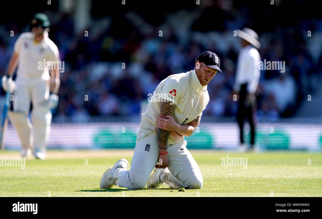 England's Ben Stokes holds his arm during day two of the fifth test ...