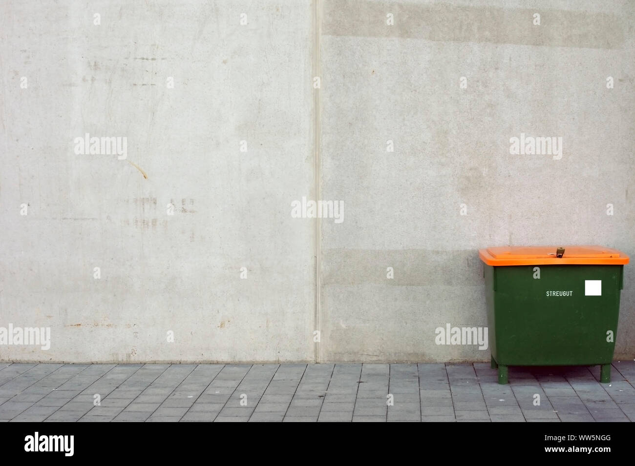 Photography of a road salt container in front of a striking concrete ...