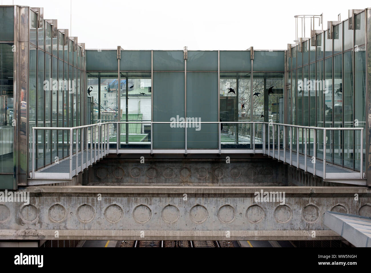 Photography of a glass passage at a tram stop Stock Photo - Alamy