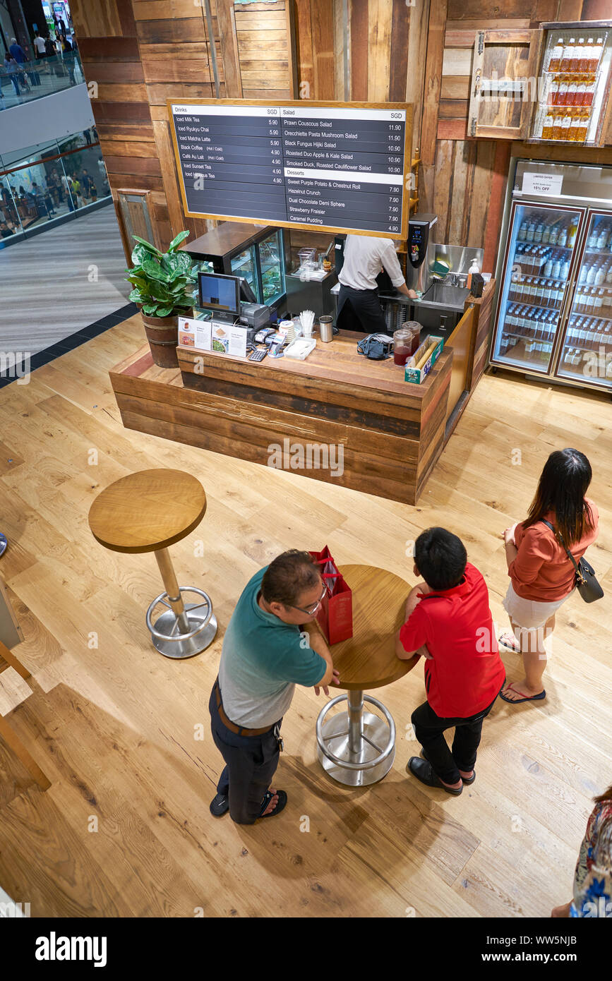 SINGAPORE - CIRCA APRIL, 2019: people at Muji cafe in Jewel Changi ...