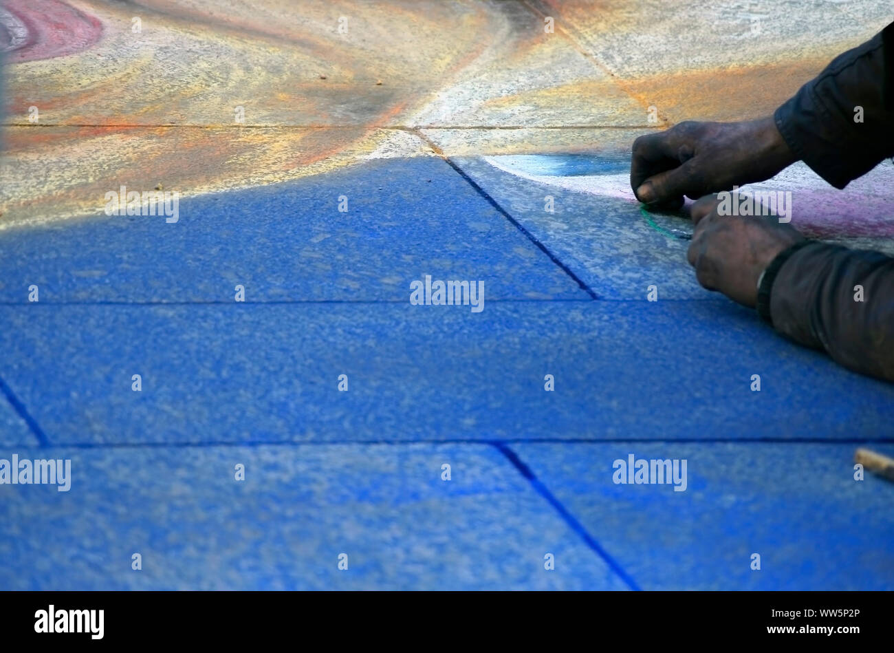 Photography of man on square drawing picture with chalk hi-res stock ...
