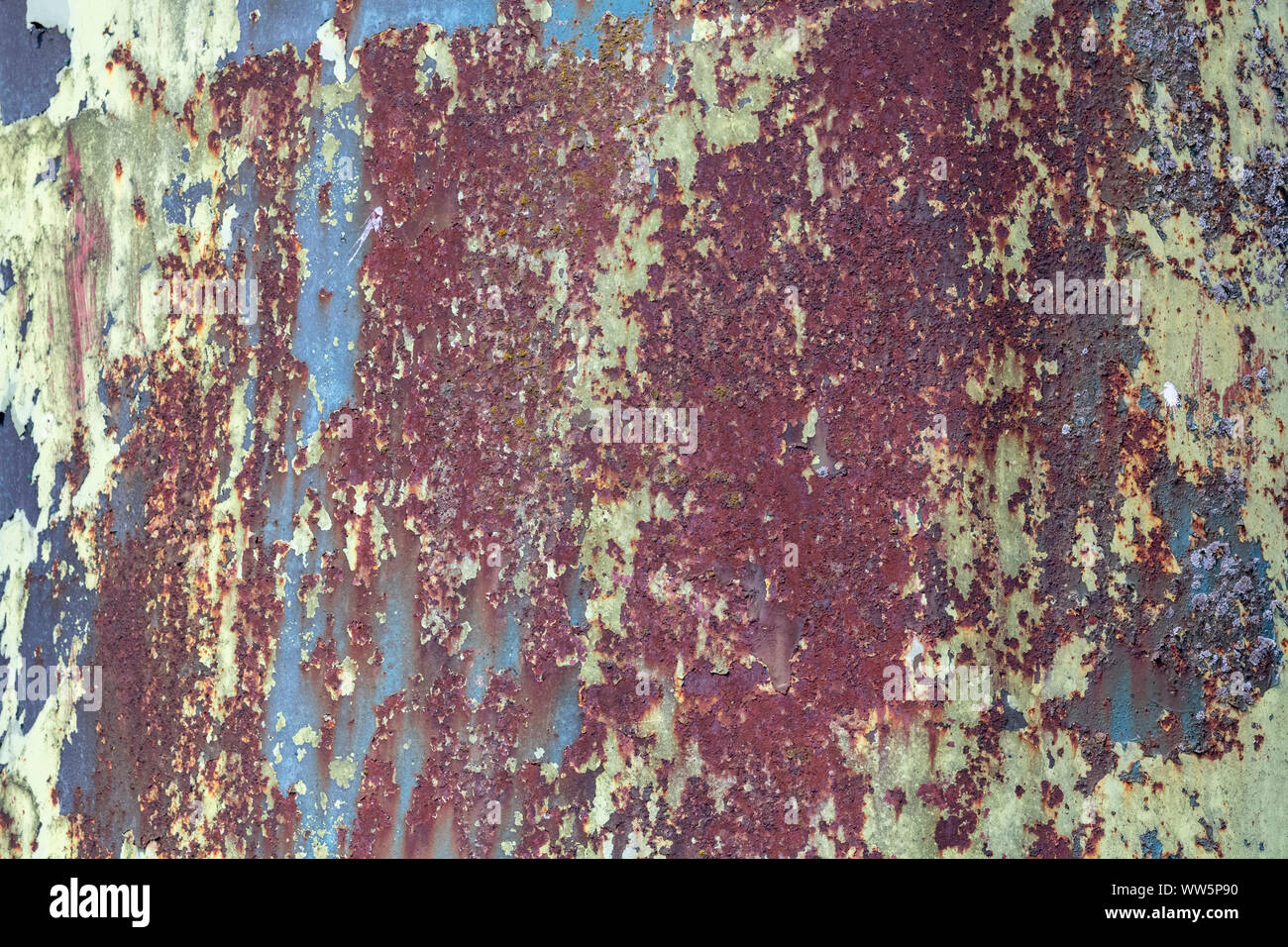 Peeling rusty metal round silo into a beautiful color as full-screen ...
