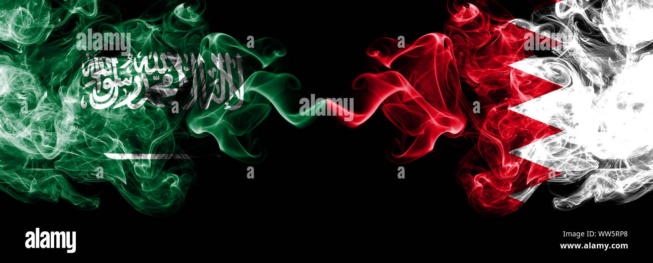 Saudi Arabia Kingdom vs Bahrain, Bahrani smoky mystic flags placed side ...