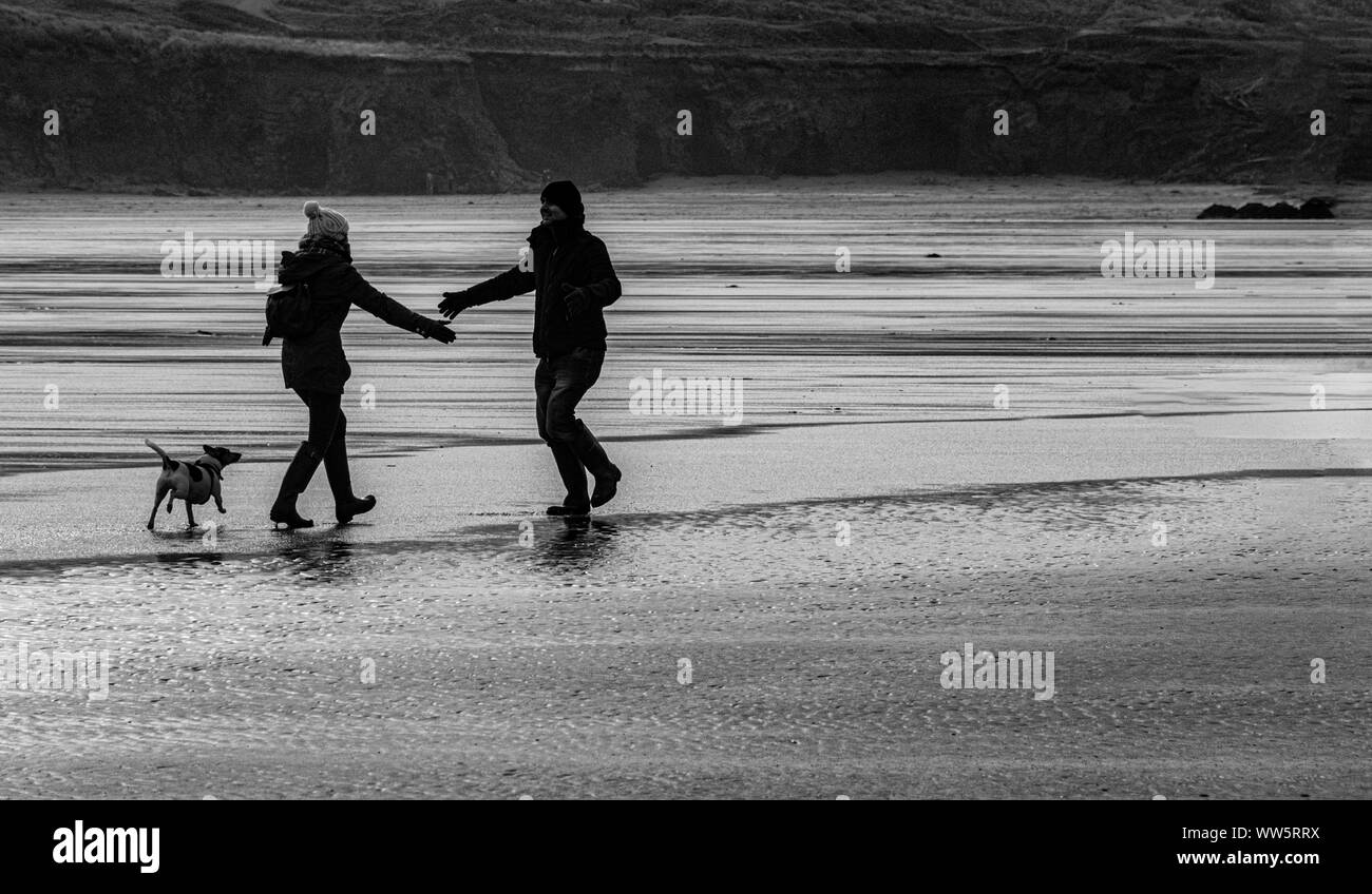 Man and women loving running towards each other on a beach ready to ...
