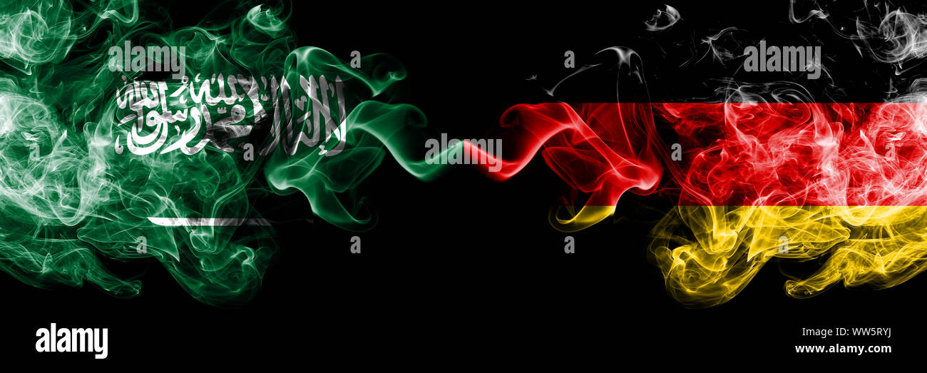 Saudi Arabia Kingdom vs Germany, German smoky mystic flags placed side ...