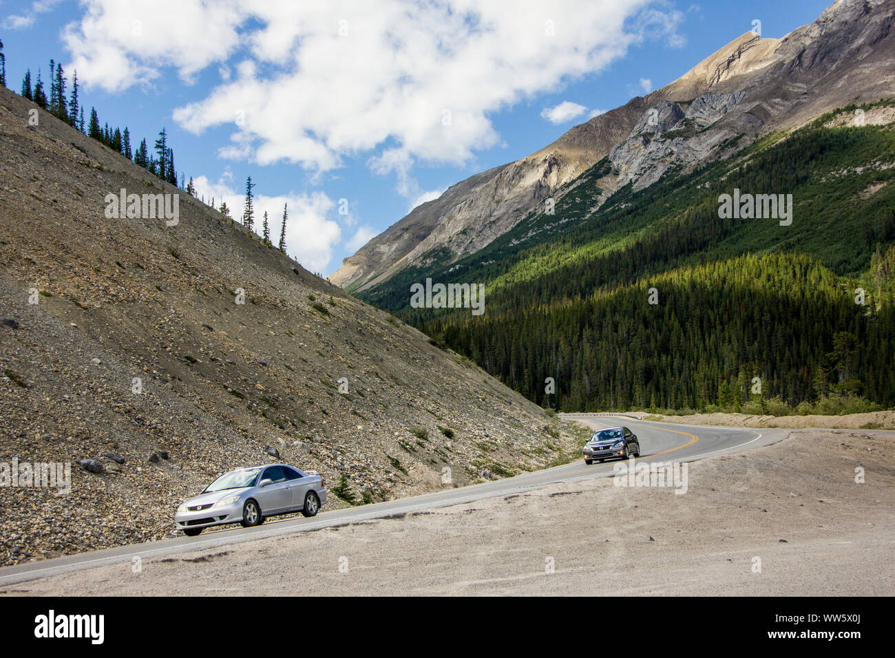Two cars driving past hi-res stock photography and images - Alamy
