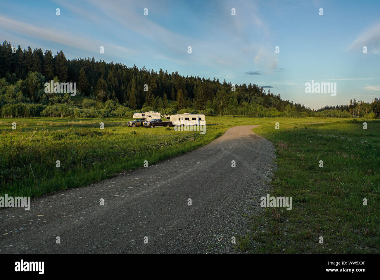 Camping with caravan and camper in the green landscape of Canada Stock ...