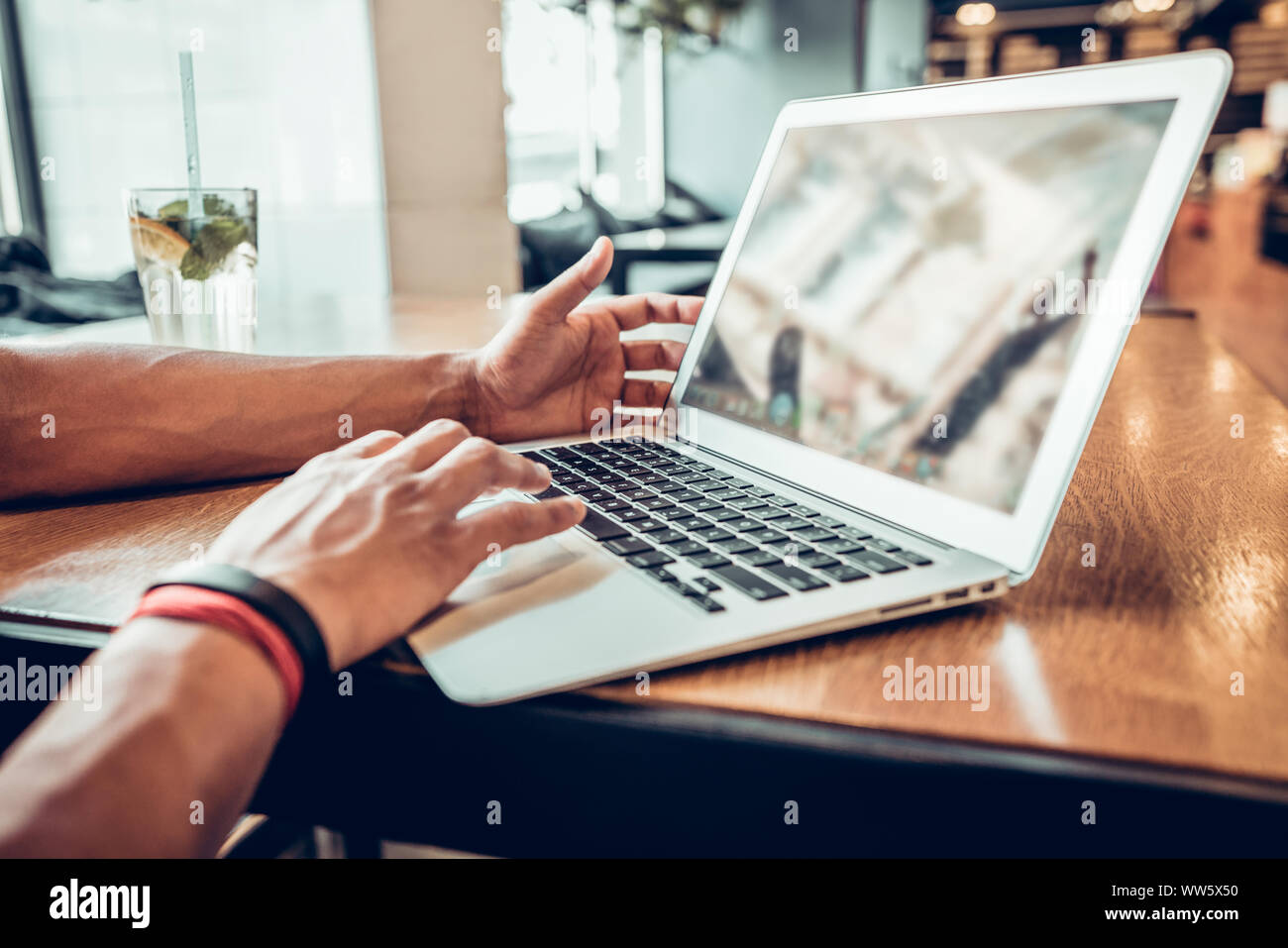 Working on laptop, close up of hands of business man Stock Photo - Alamy