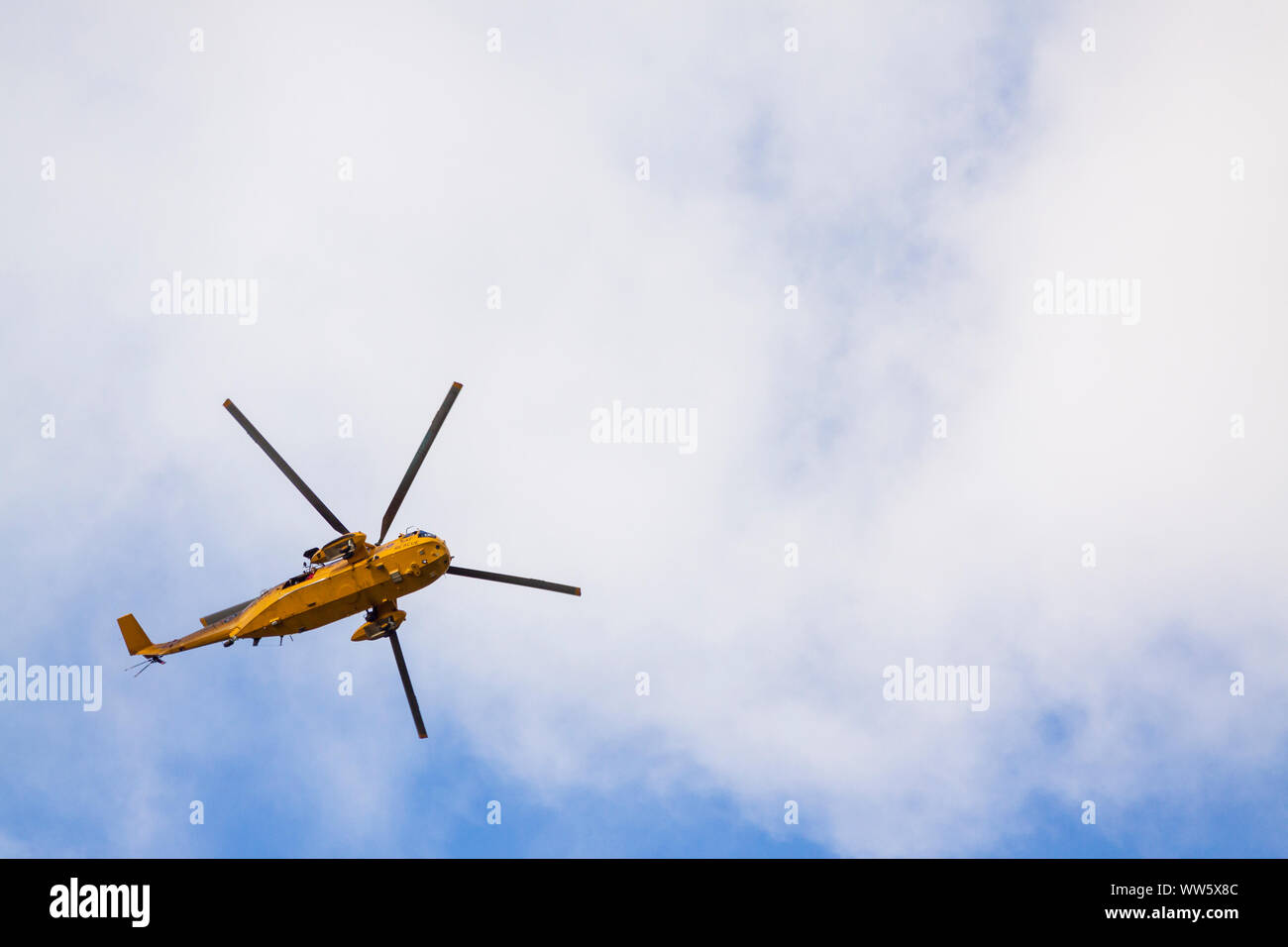 Seaking search and rescue helicopter in flight against a blue sky Stock ...