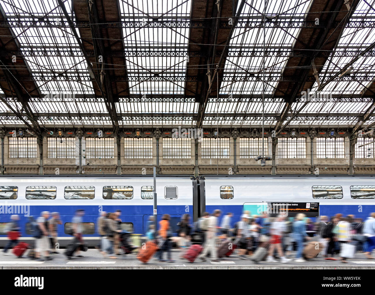 France, Paris, railway station, train, platform hall, person run on the ...