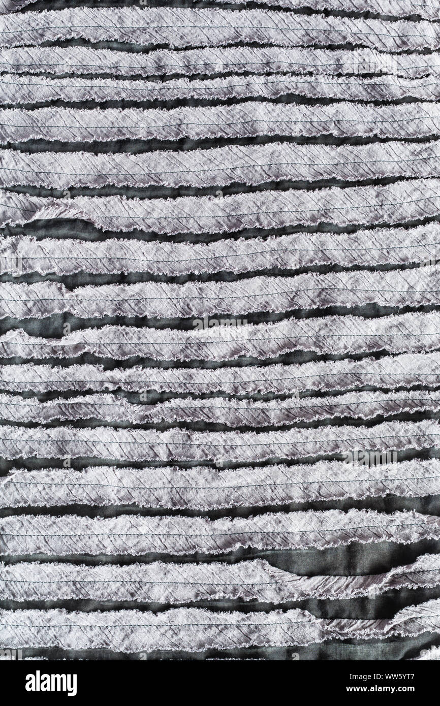 textile vertical background - surface of cloth stitched from carved ...