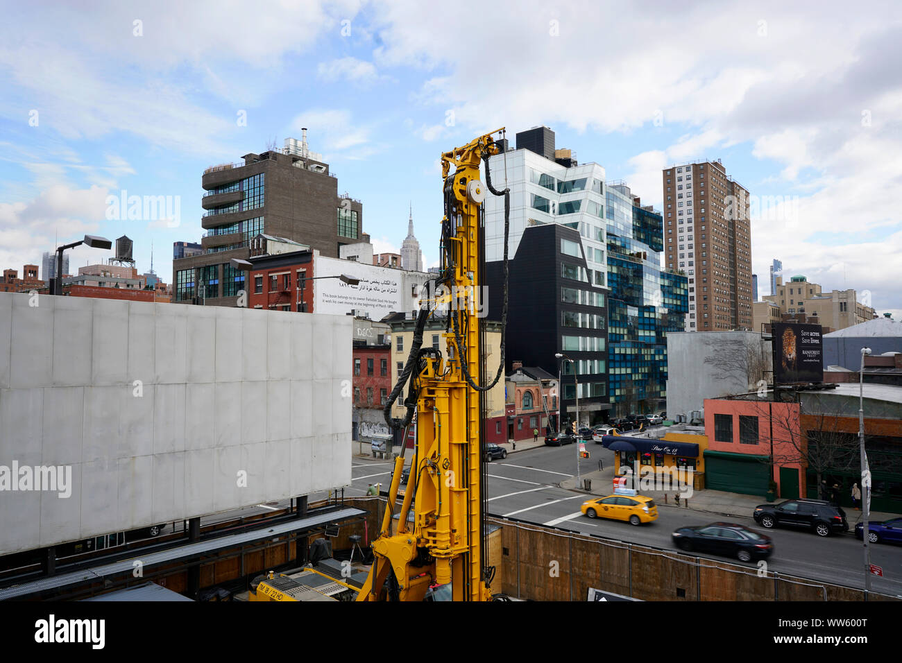 An engineering vehicle on a construction site in front of modern ...