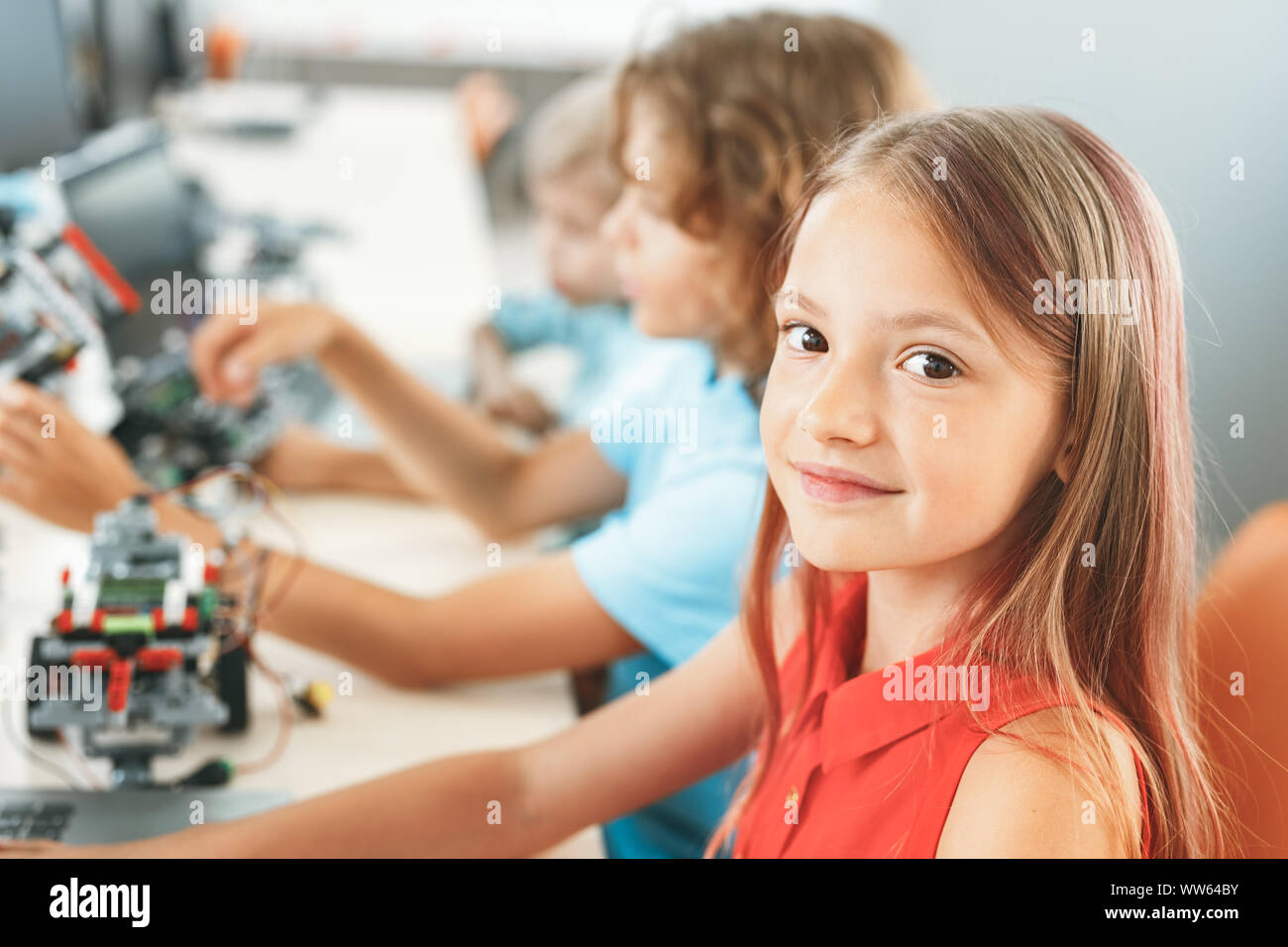 Robotics. Children having class making robots girl close-up smiling ...