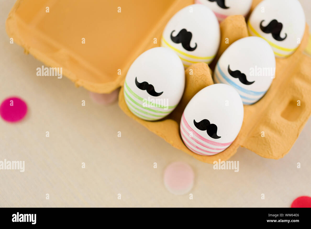 Easter eggs with moustache and stripes in the egg carton Stock Photo ...