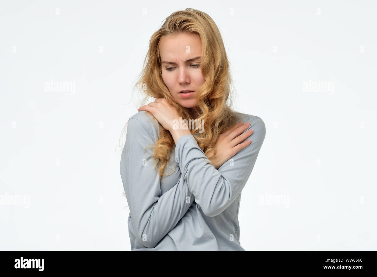 Young blonde woman feeling sick head ache and cold or flew, having ...
