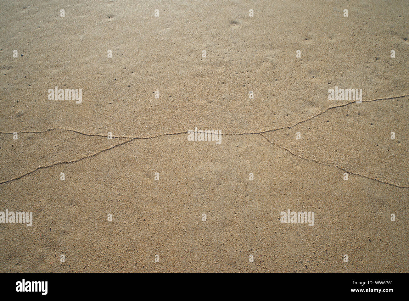 Connection / line in sand Stock Photo - Alamy