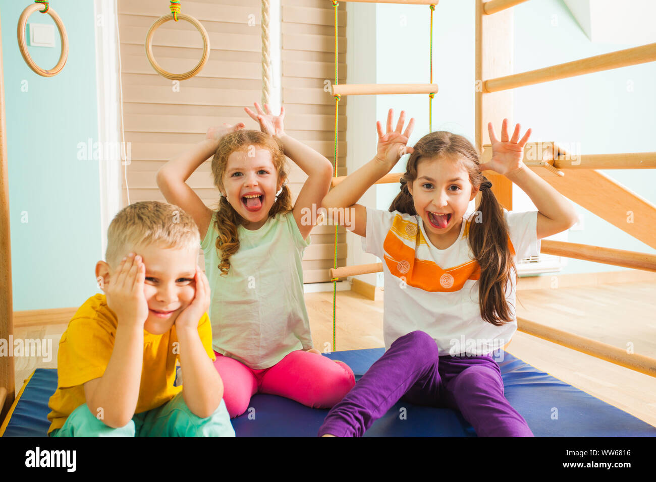 Portrait of cheerful smiling children on mate, looking at the camera ...