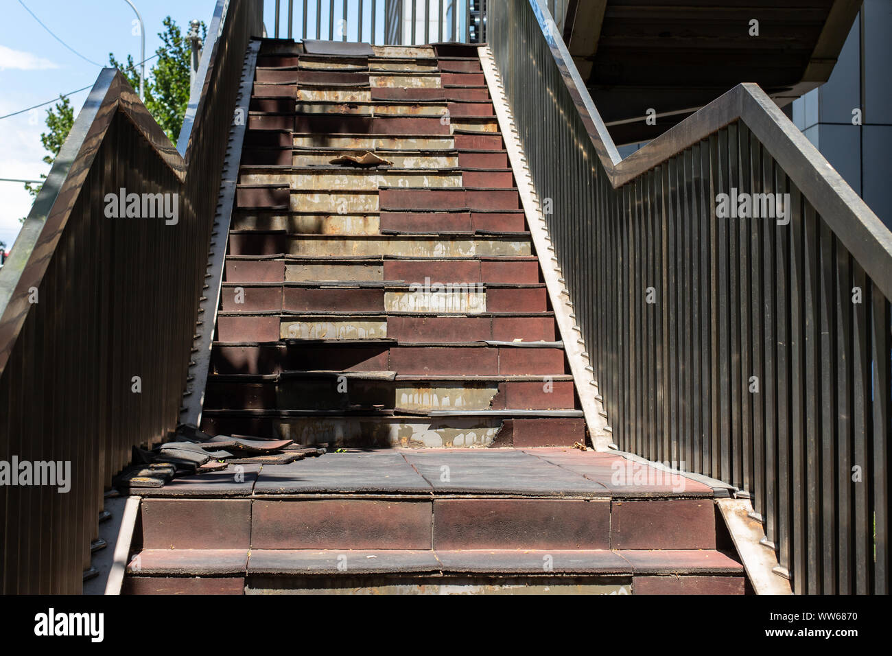 Damaged staircase. Old staircase in the metropolis. Broken stairs on a ...