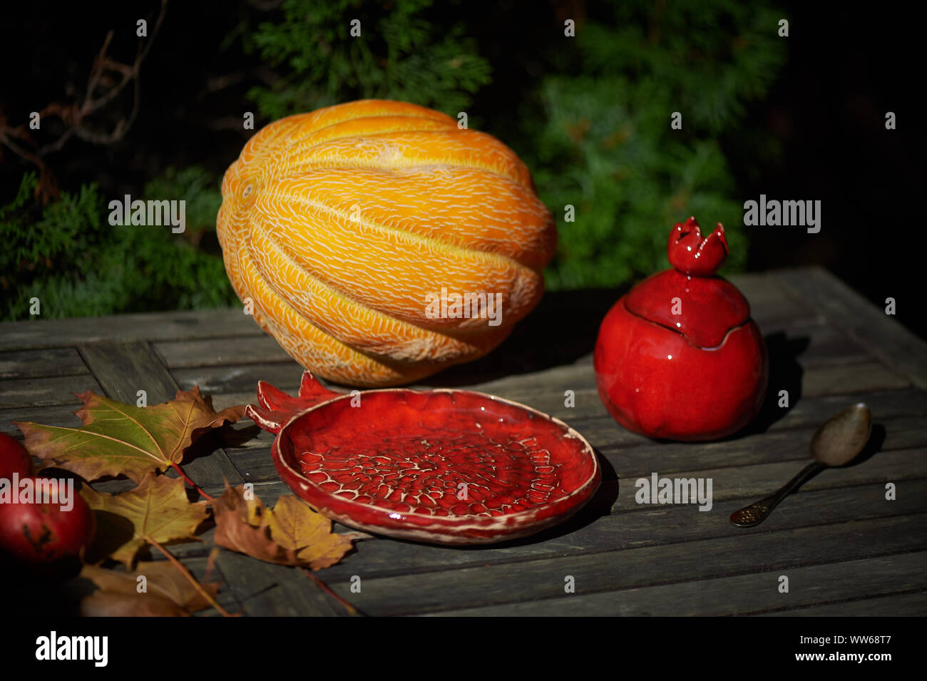 Red ceramic, handmade.Shaped like a grenade Stock Photo - Alamy
