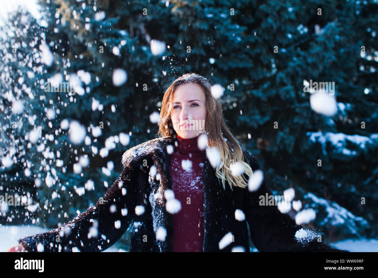 Fun and enjoy, games with the snow, woman after the flying snowball ...