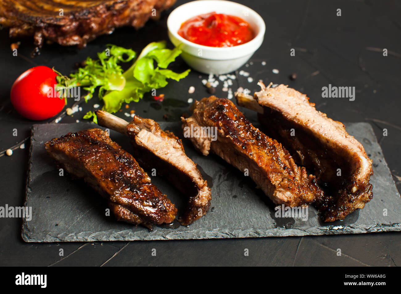 Roasted sliced barbecue pork ribs, focus on sliced meat Stock Photo - Alamy